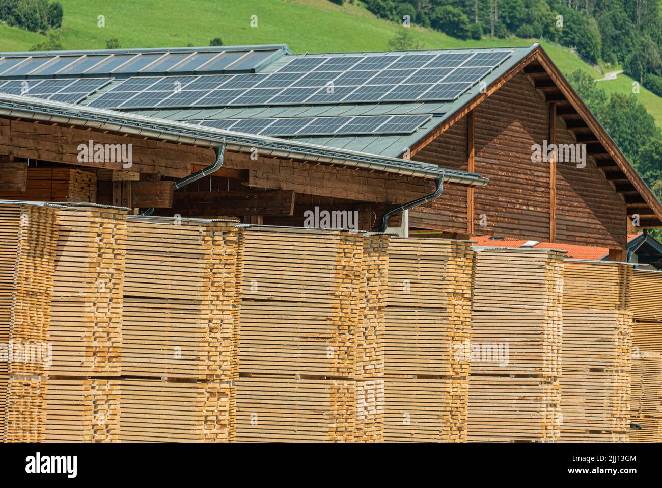 Lots of planks stacked on top of each other in the warehouse. Lumber ...