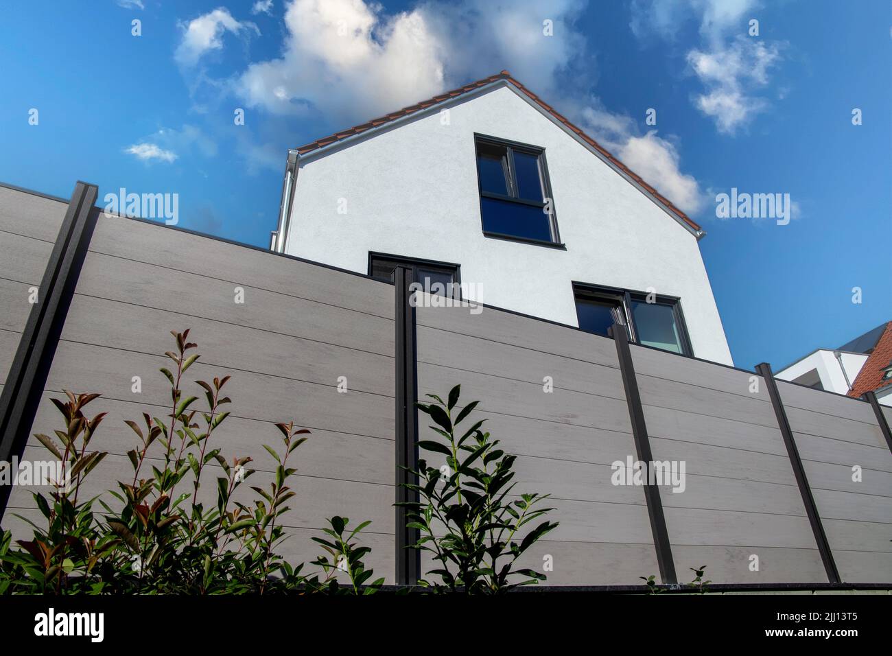 Modern privacy fence as garden or property boundary Stock Photo - Alamy