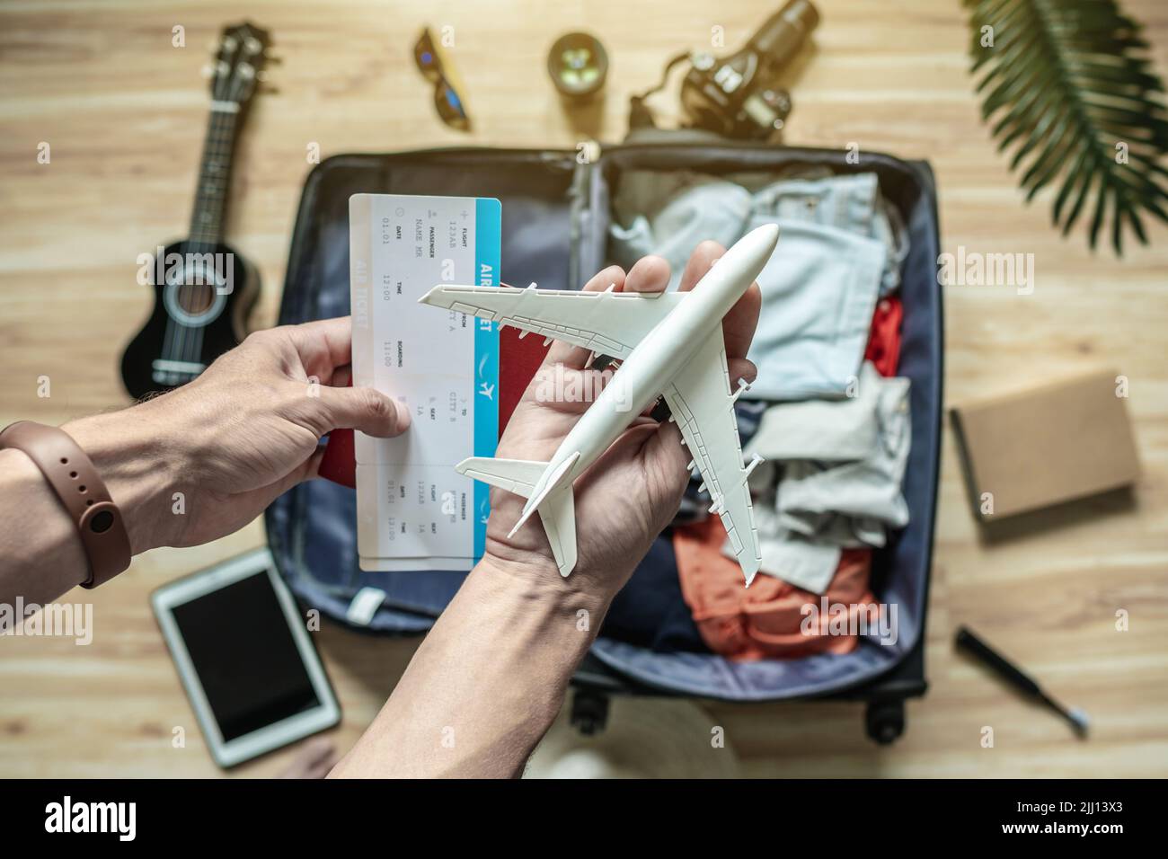 Packing a suitcase for a summer vacation. Preparation of things and ...