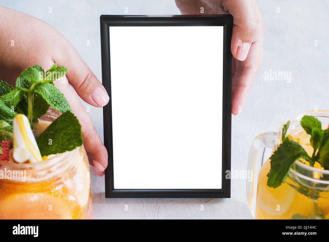 Picture frame with fresh fruit cocktails in front Stock Photo - Alamy