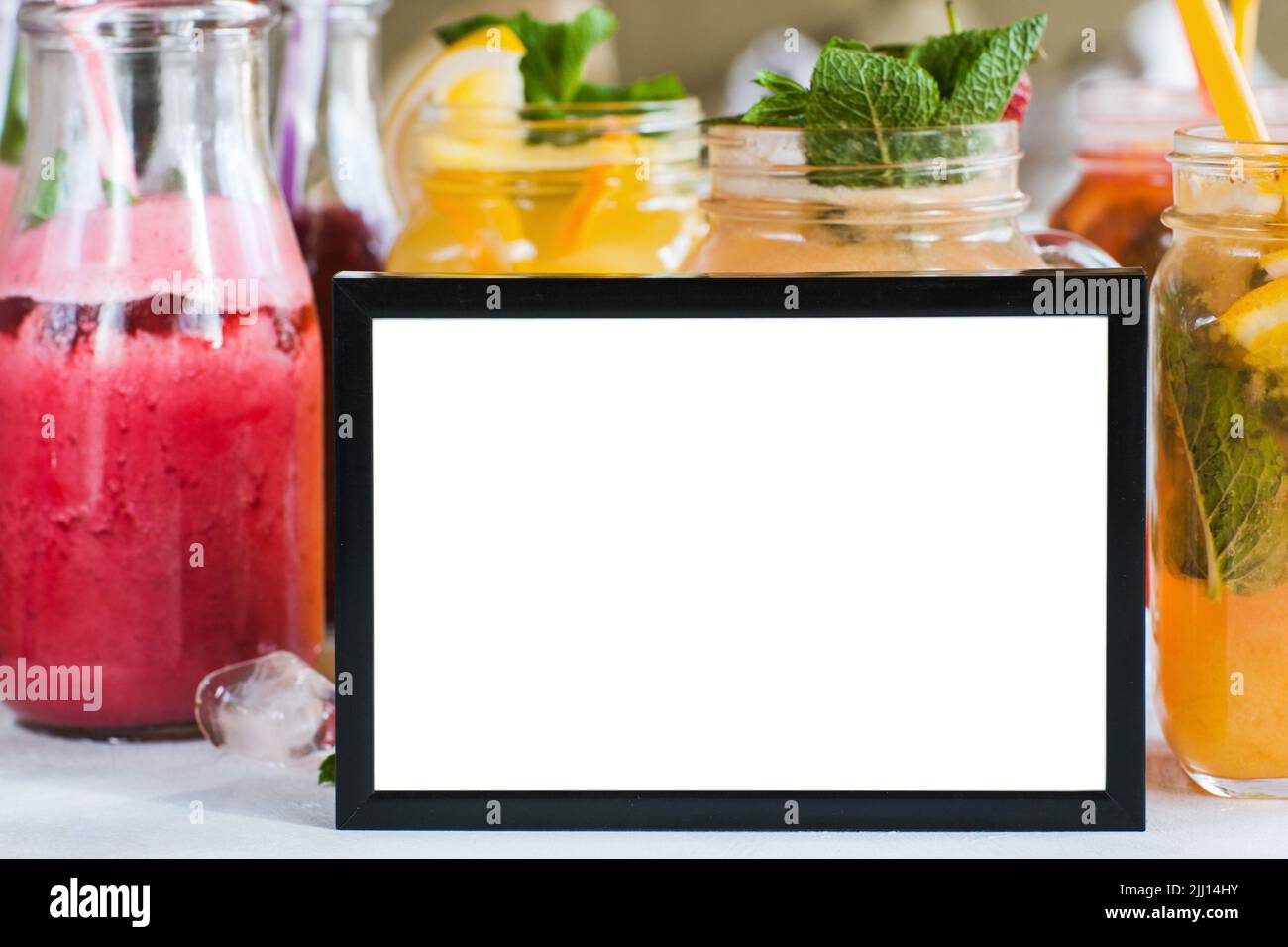 Picture frame with fresh fruit drinks behind Stock Photo - Alamy