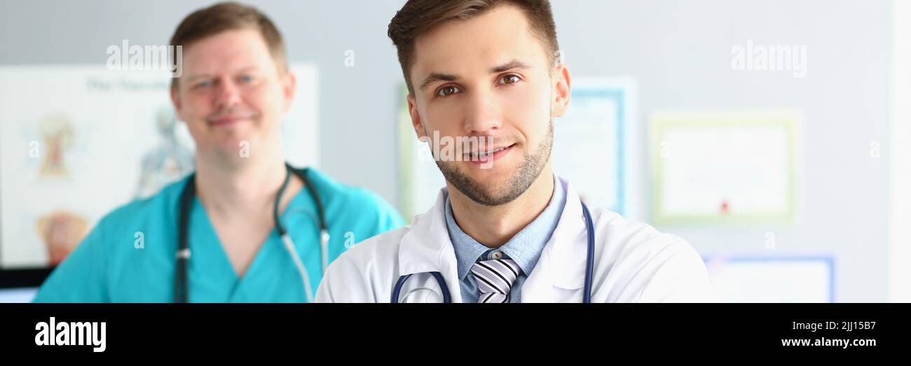 Medical male workers in uniform with stethoscopes, medical help ...