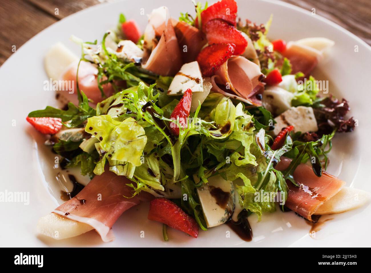 Fresh salad with parma ham and blue cheese Stock Photo - Alamy