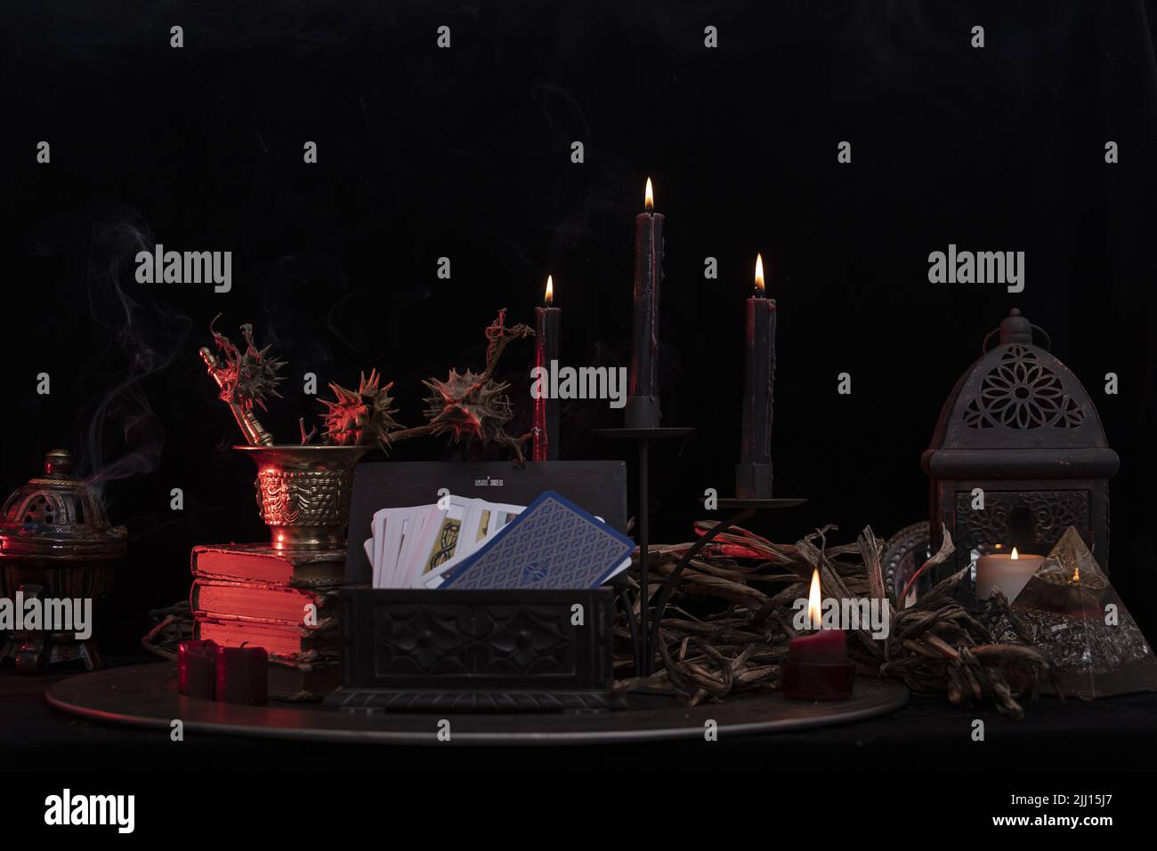 Witch laboratory with potion, elixirs, glass bottles, dry flowers ...