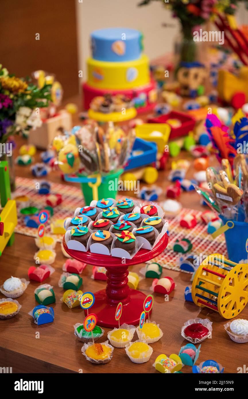 A setup of a child birthday party table with cake and sweets Stock ...