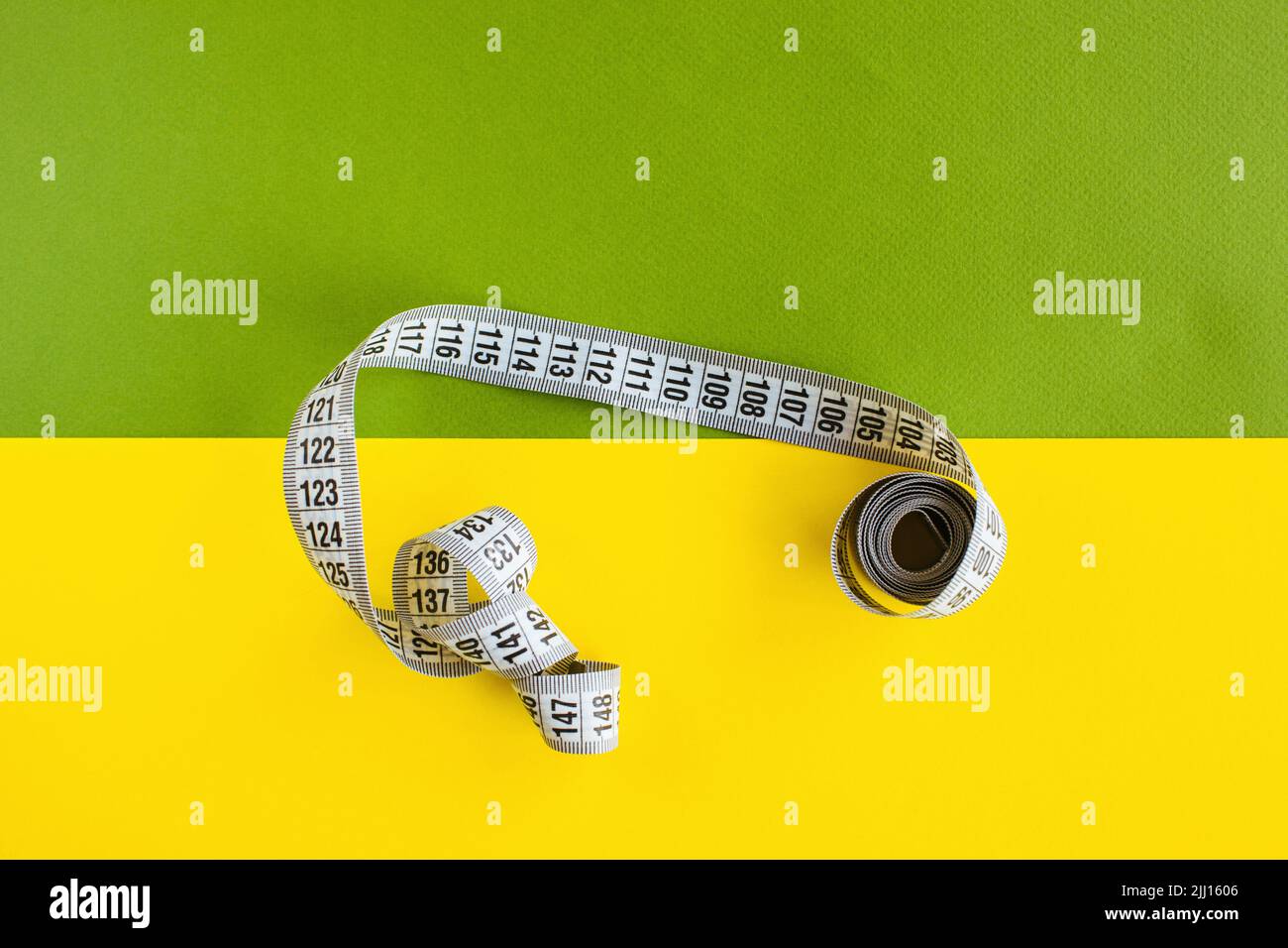 Tape measure on colorful background Stock Photo - Alamy