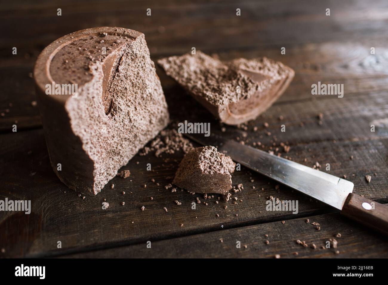 Broken off big piece of aerated chocolate Stock Photo - Alamy