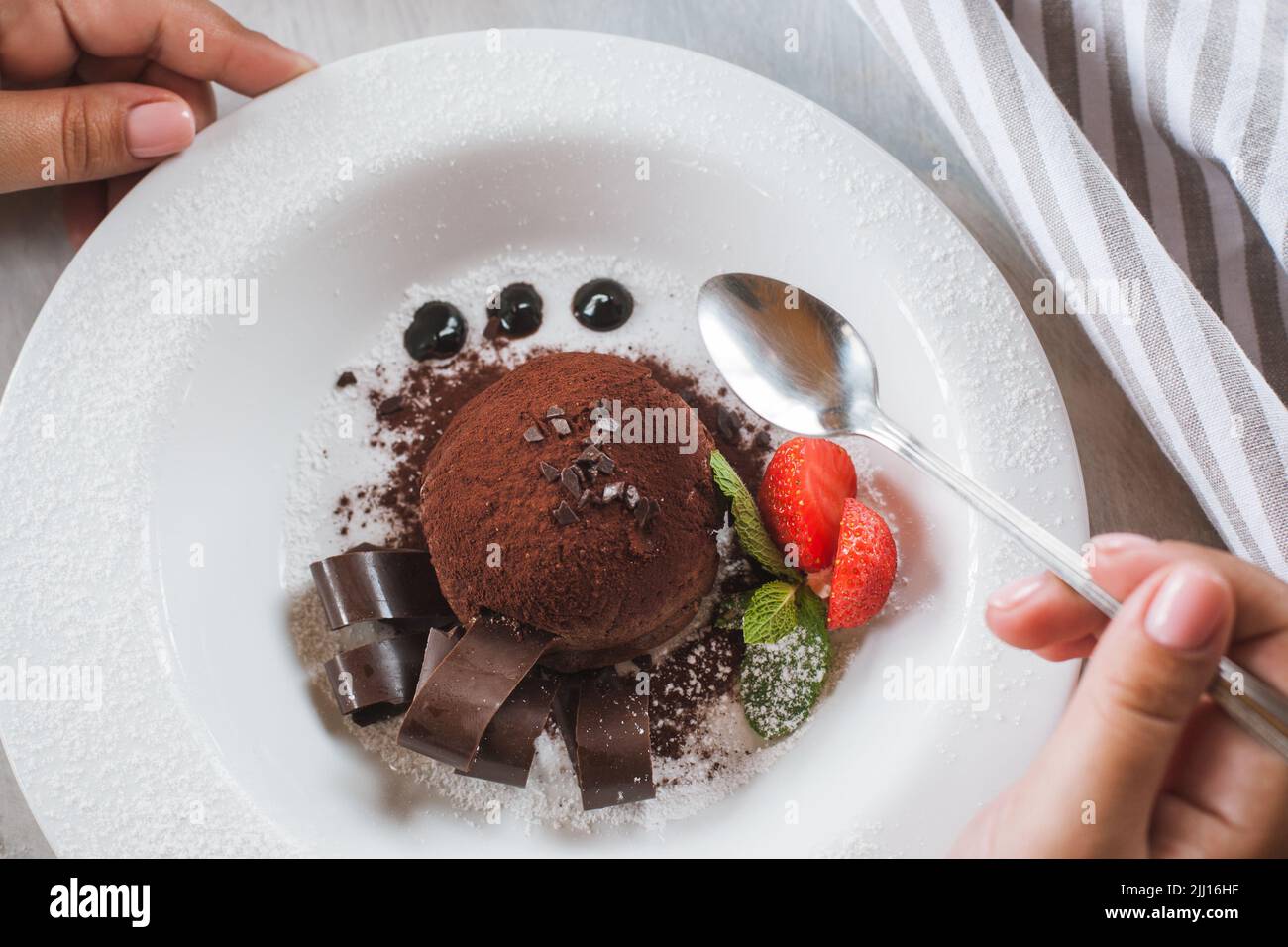 Tasting of delicious chocolate dessert Stock Photo - Alamy