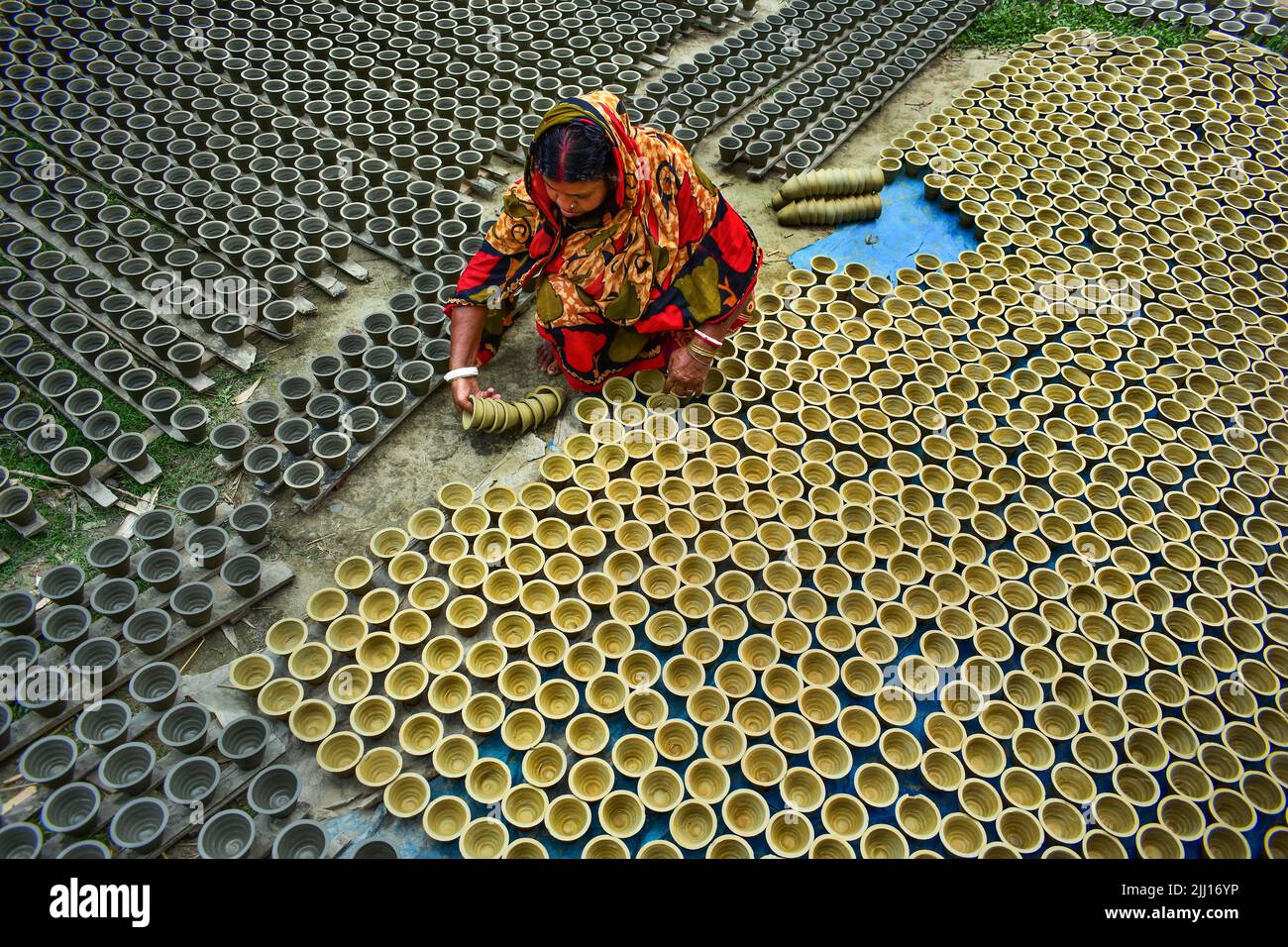 Potters spinning clay by hand in rural Bangladesh, showcasing village ...