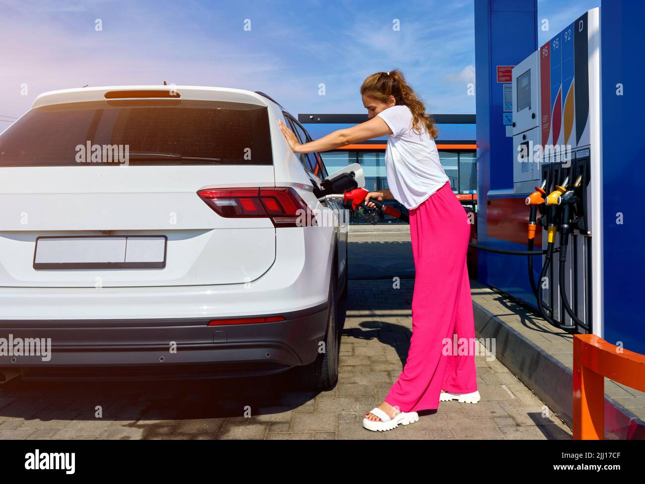Woman refuels car hi-res stock photography and images - Alamy Woman refuels car hi-res stock photography and images - Alamy