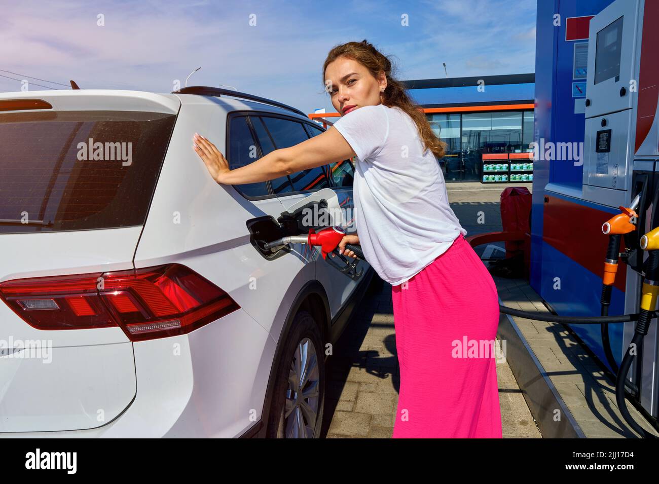 Woman refuels car hi-res stock photography and images - Alamy Woman refuels car hi-res stock photography and images - Alamy