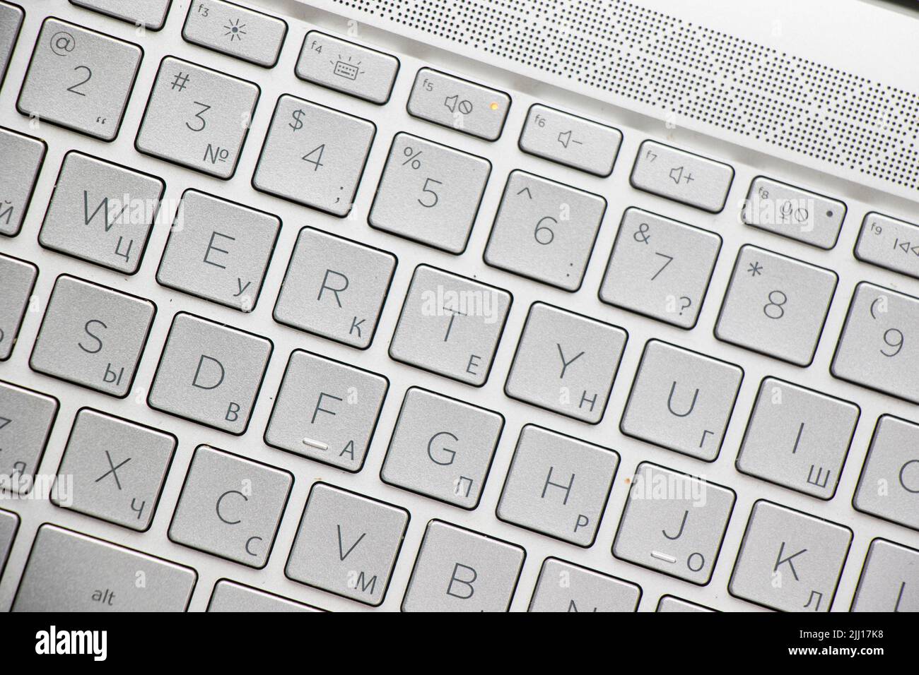 Laptop and notebook computer keyboard close-up, texts, keys and gray ...