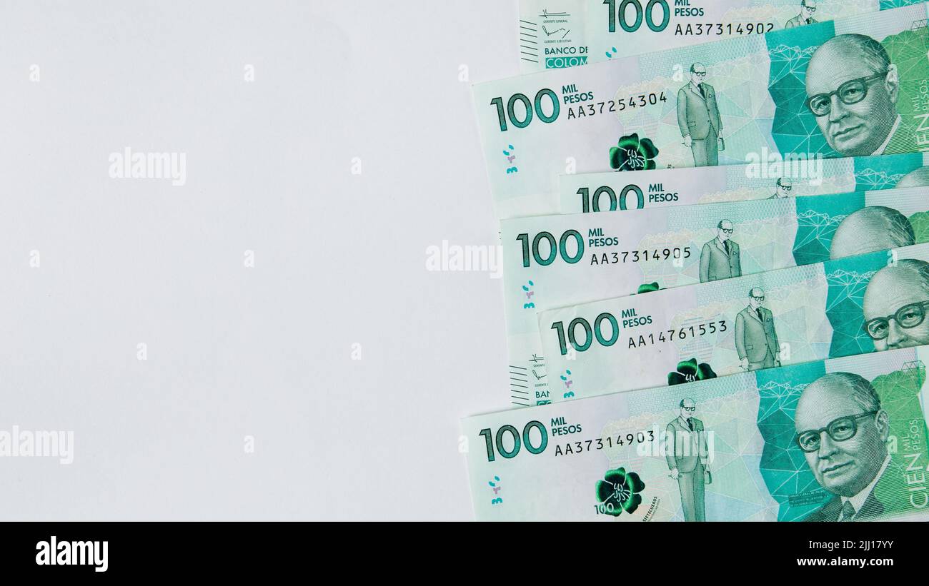 A Colombian money, one hundred thousand pesos on white background with ...
