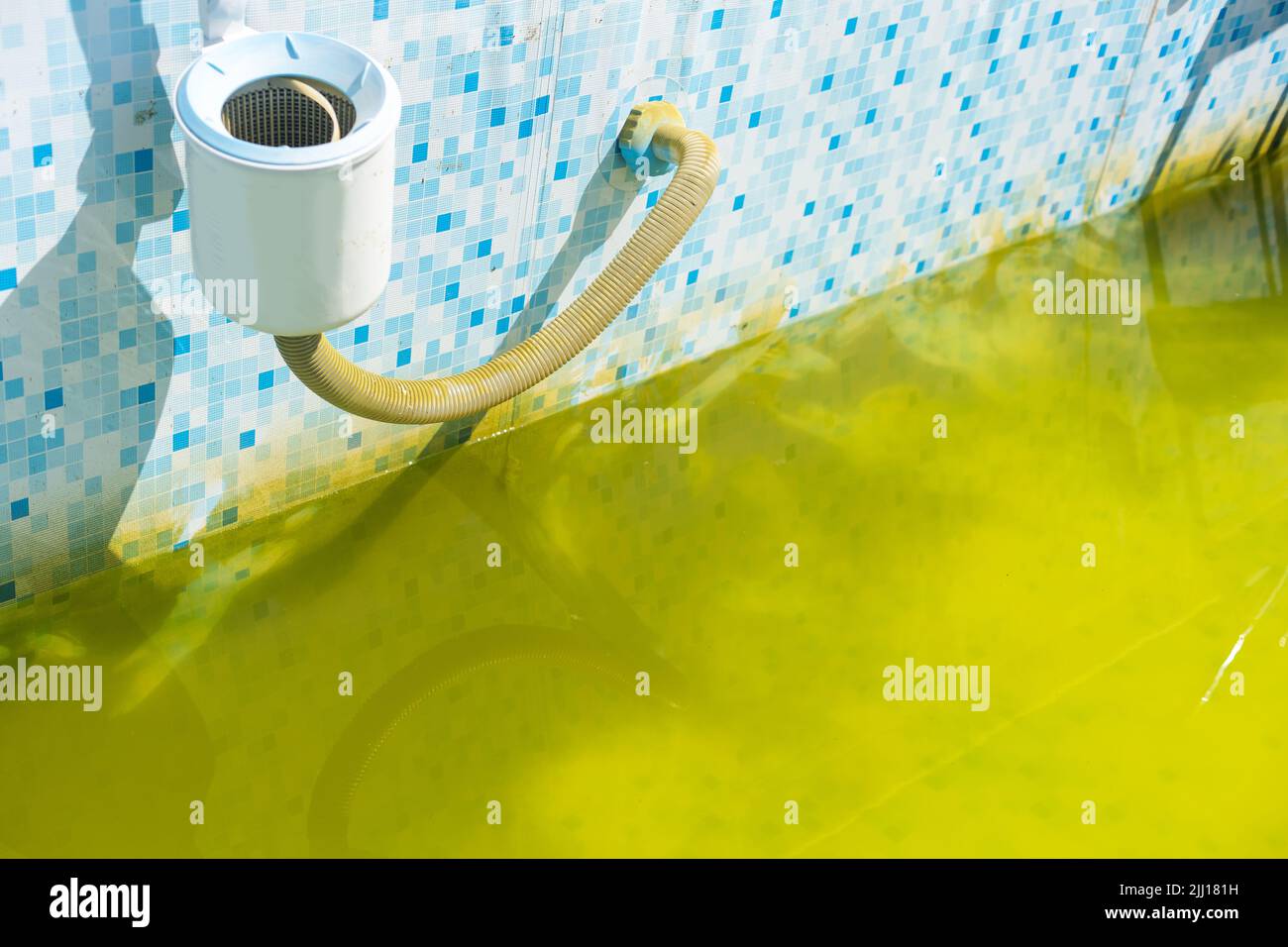 cleaner and filter very dirty swimming pool in the garden Stock Photo ...