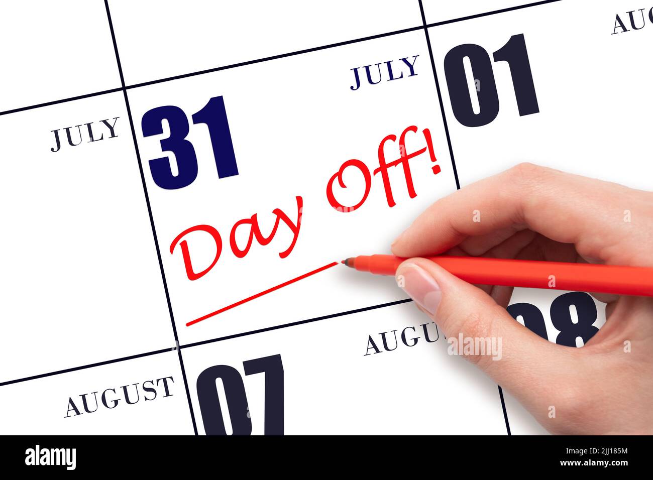 31st day of July. Hand writing text DAY OFF and drawing a line on ...