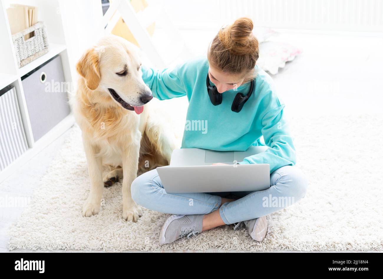 Nice teenage girl working on computer Stock Photo - Alamy