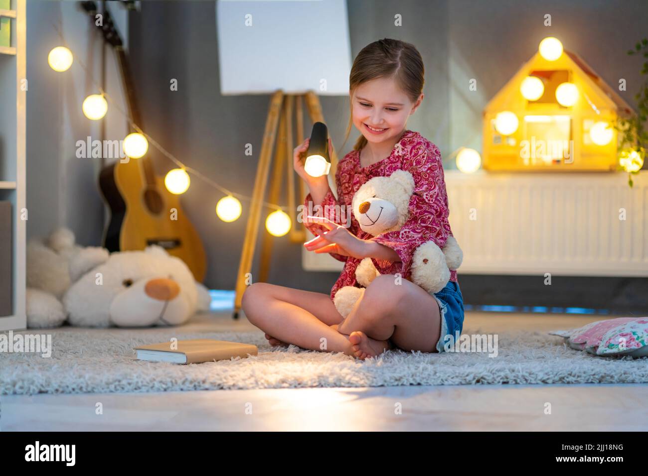 Happy little girl playing with shadows Stock Photo - Alamy