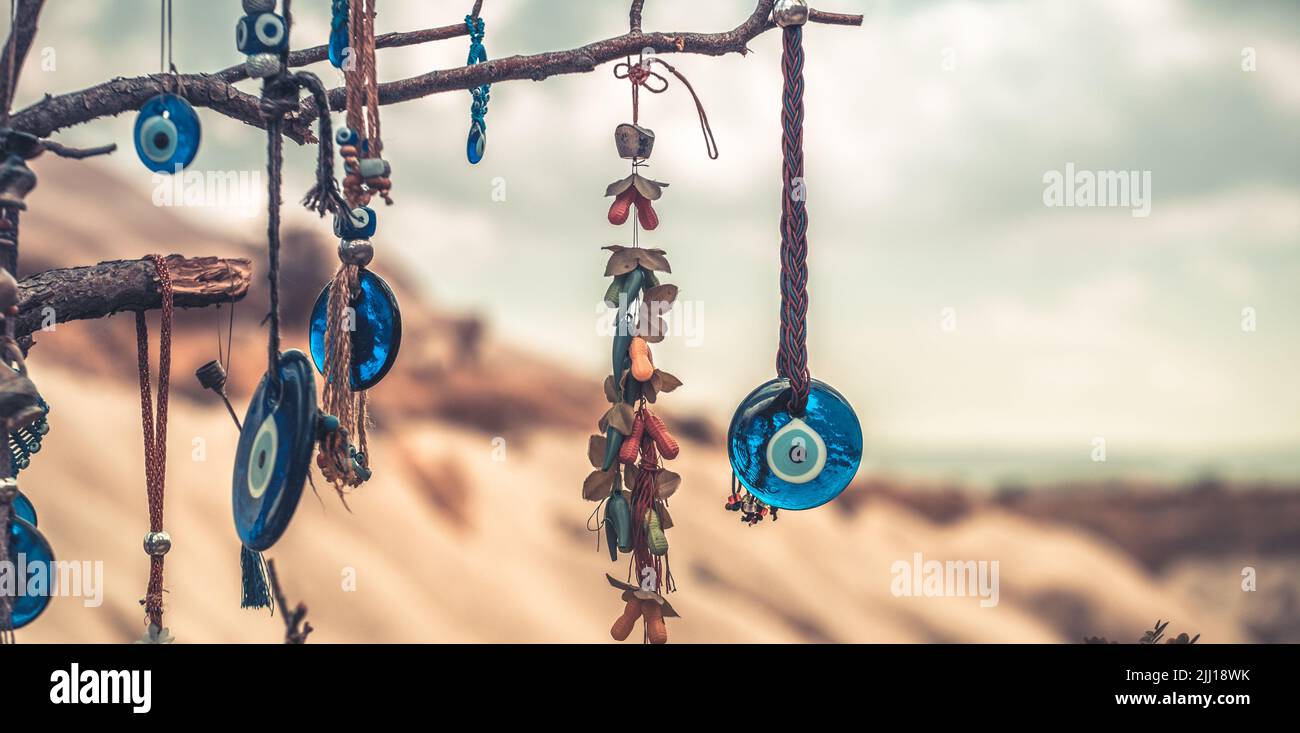 Amulets from evil eye hanging on tree Stock Photo - Alamy