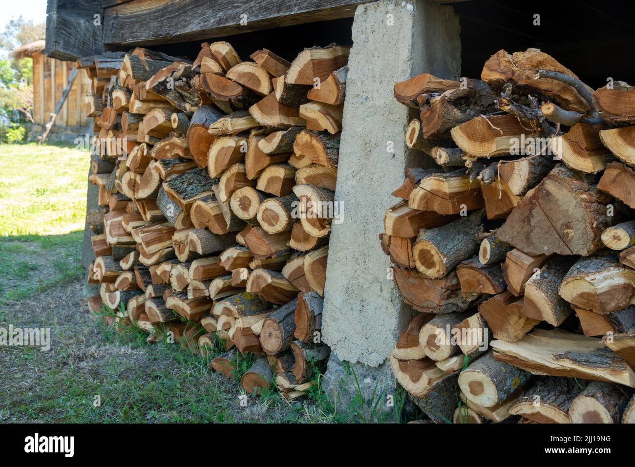 Preparation of firewood for the winter. firewood background, Stacks of ...