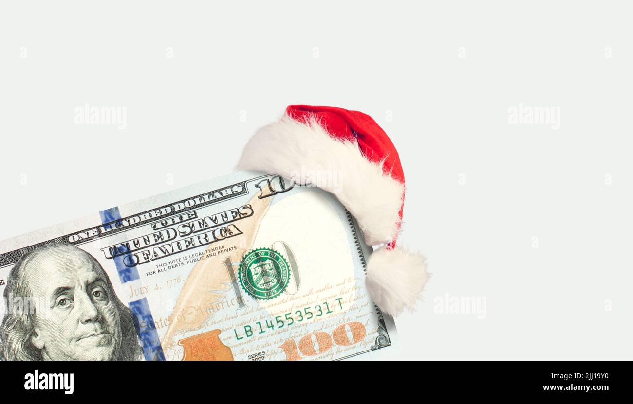 Banknote wearing Santa Claus on white background Stock Photo - Alamy