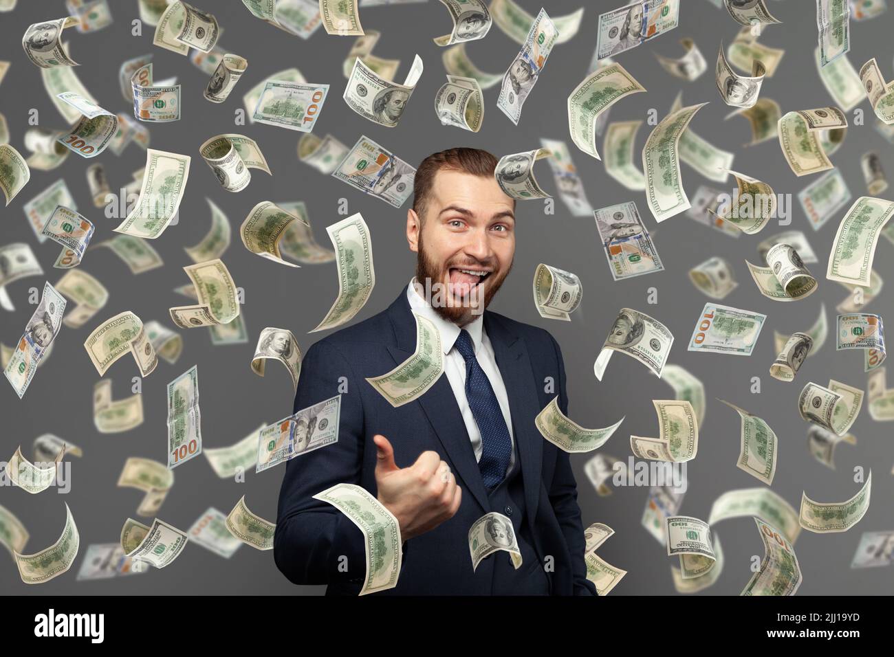 Funny excited businessman and flying dollar banknotes Stock Photo - Alamy