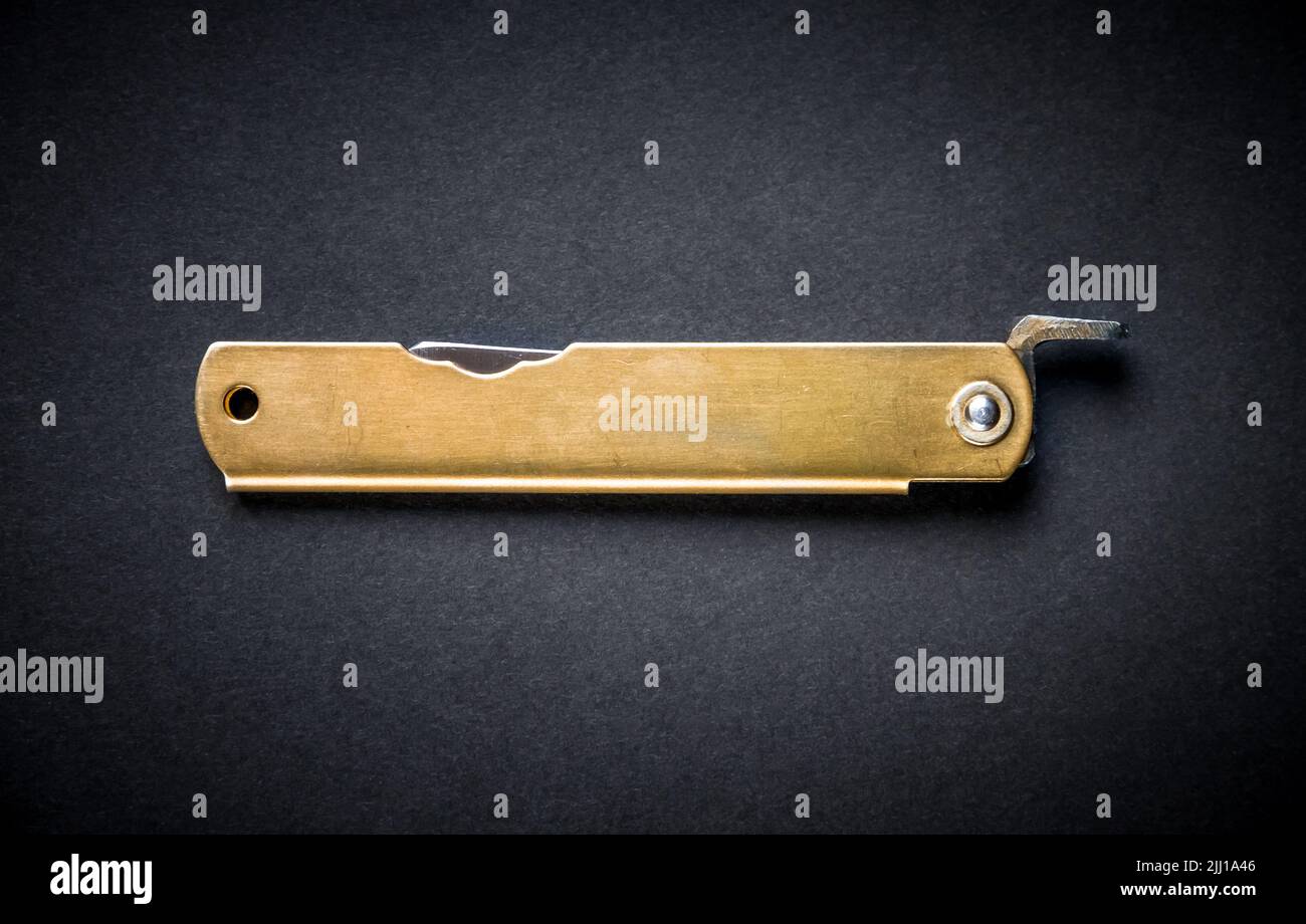 Traditional japanese higonokami pocket knife isolated on black ...