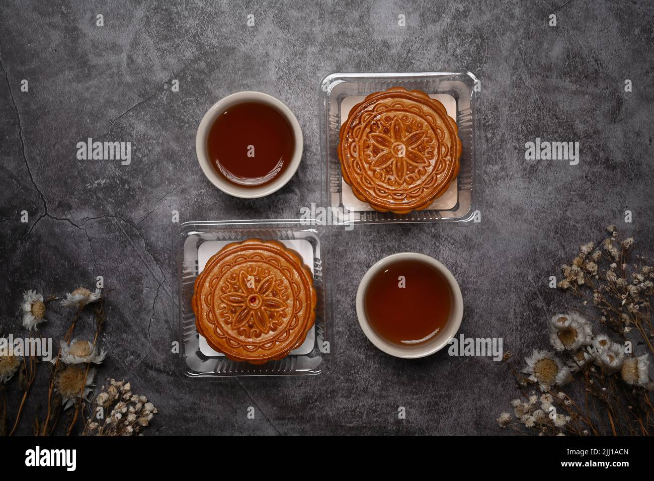 Flat lay Chinese traditional mid autumn festival moon cake on grey ...