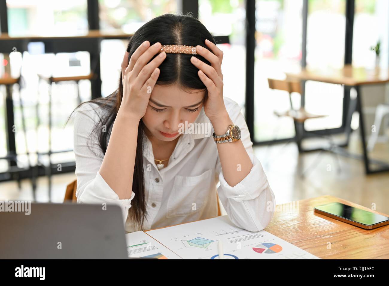 Stressed millennial Asian female office worker or businesswoman crying ...