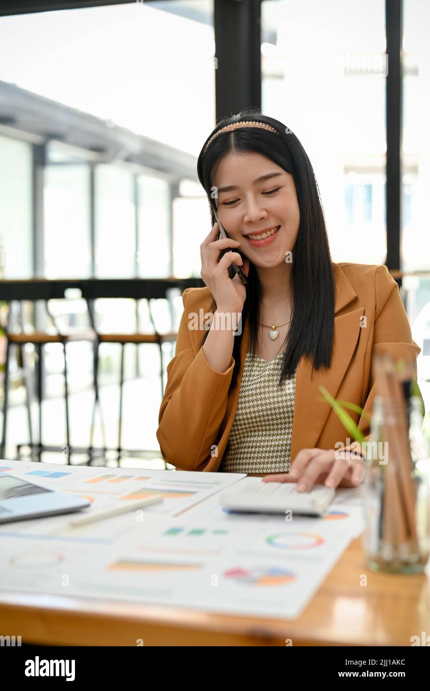 Portrait of a Beautiful young Asian female accountant or financial ...