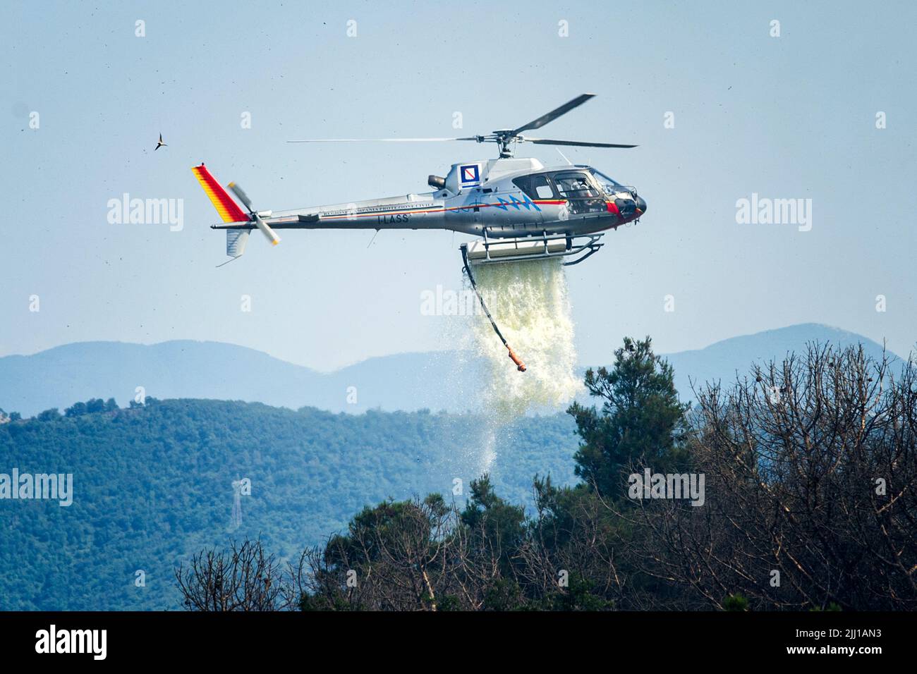 Firefighting helicopter of the Campania Region, during an intervention ...