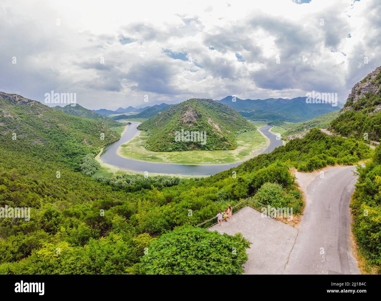 Tourists in the background Canyon of Rijeka Crnojevica river near the Skadar lake coast. One of ...