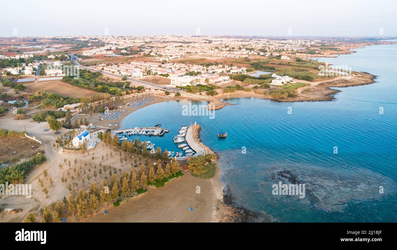 Aerial view of coastline sunset and landmark white washed chapel at ...