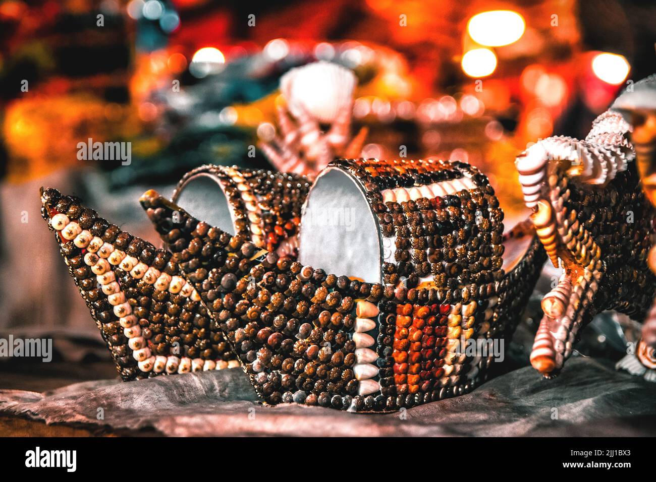 A closeup of a showpiece of boats made from snail shells Stock Photo ...