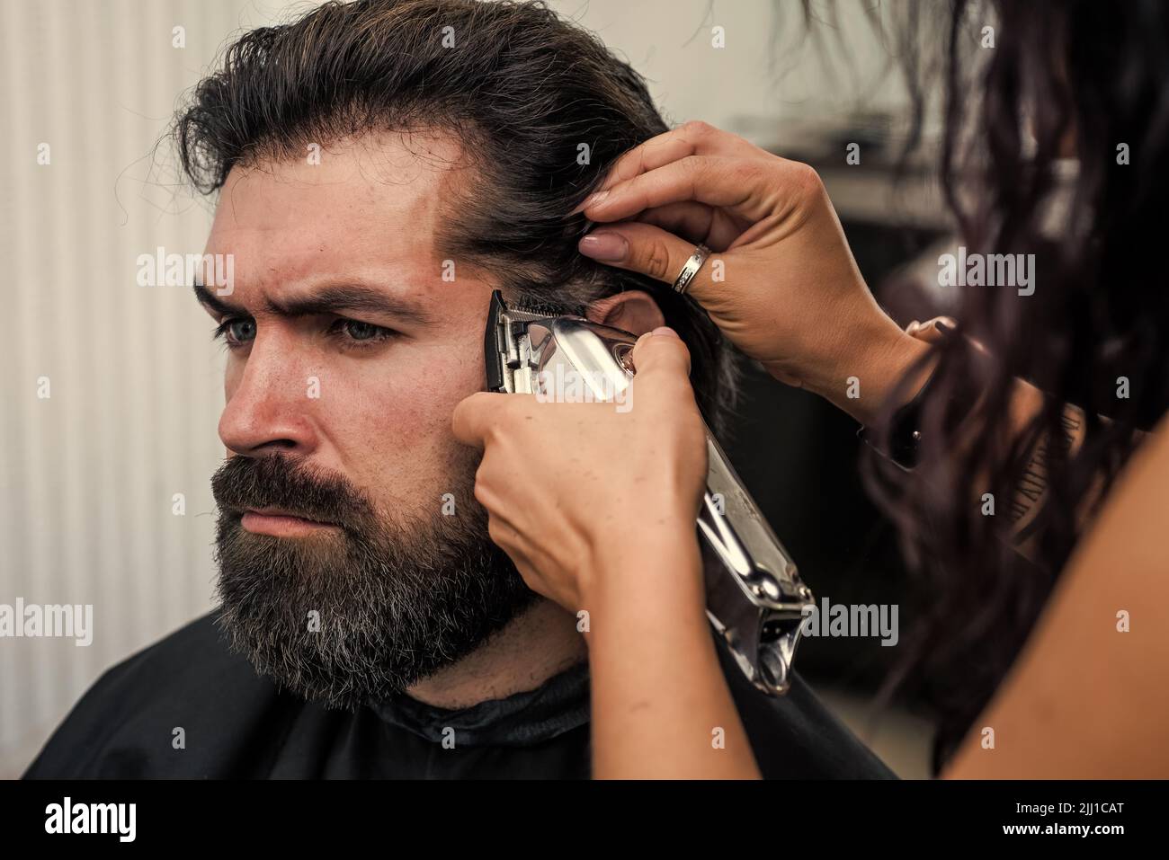 hair cut and beard care for caucasian guy in barbershop, haircare Stock ...