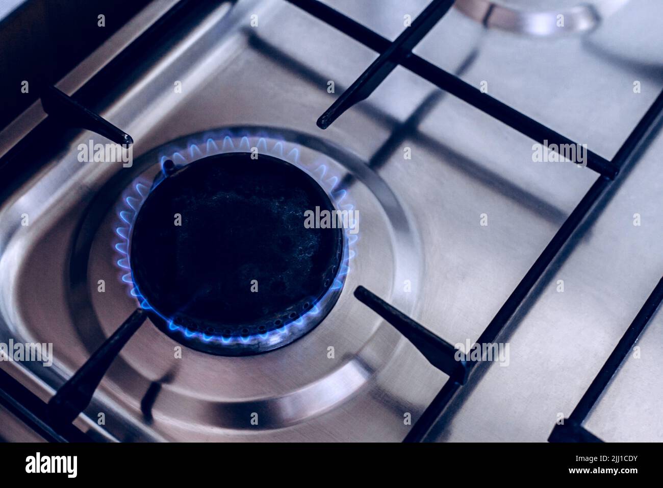 Kitchen gas hob, stove cook with blue flames burning Stock Photo - Alamy