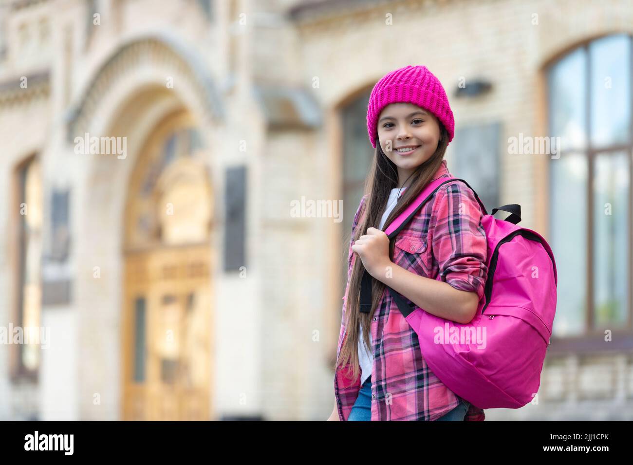 Happy tween girl back to school outdoors, copy space Stock Photo - Alamy