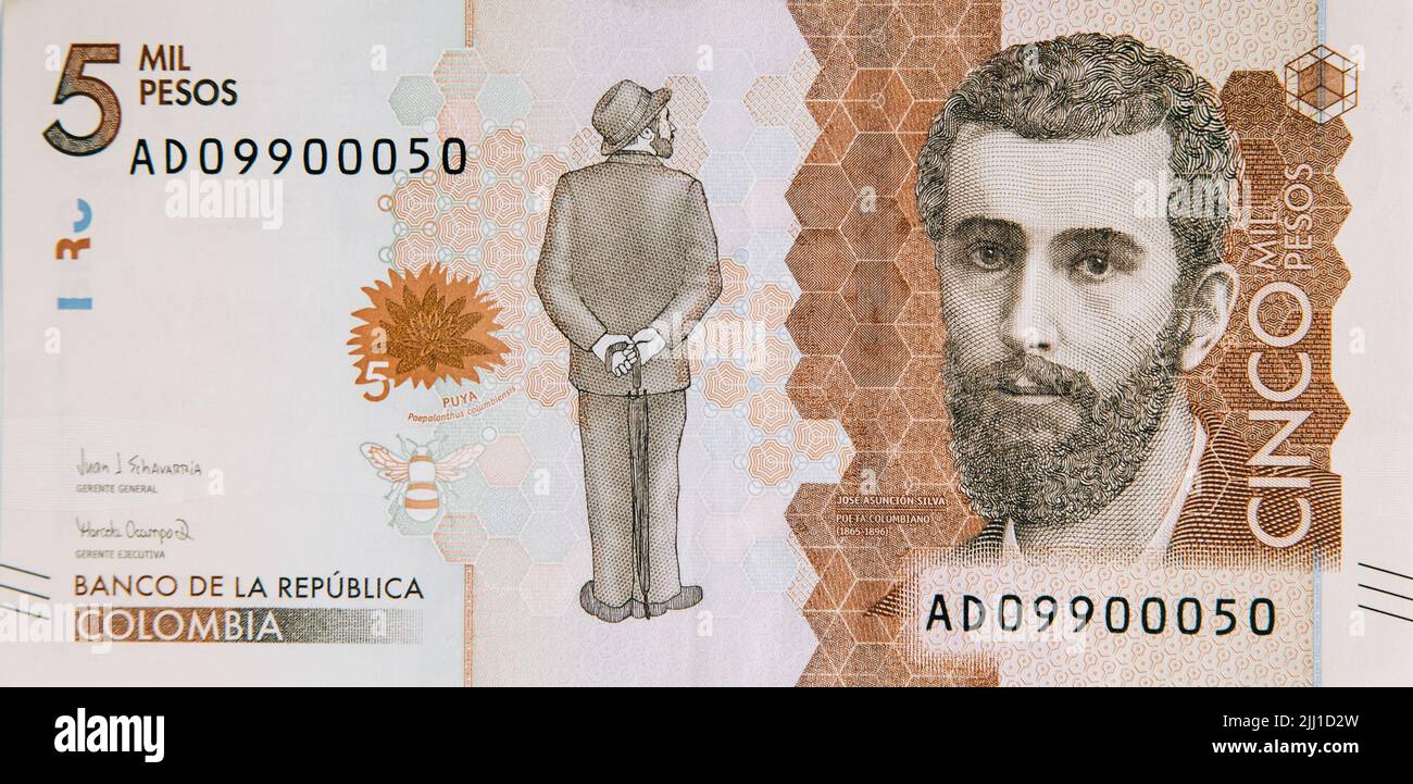 A Colombian money, five thousand pesos on white background. Business ...