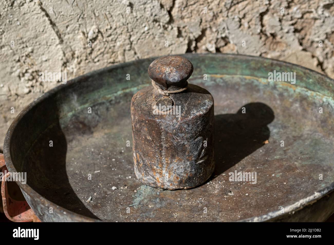 Selective focus shot of iron kilogram scale placed in old metal ...