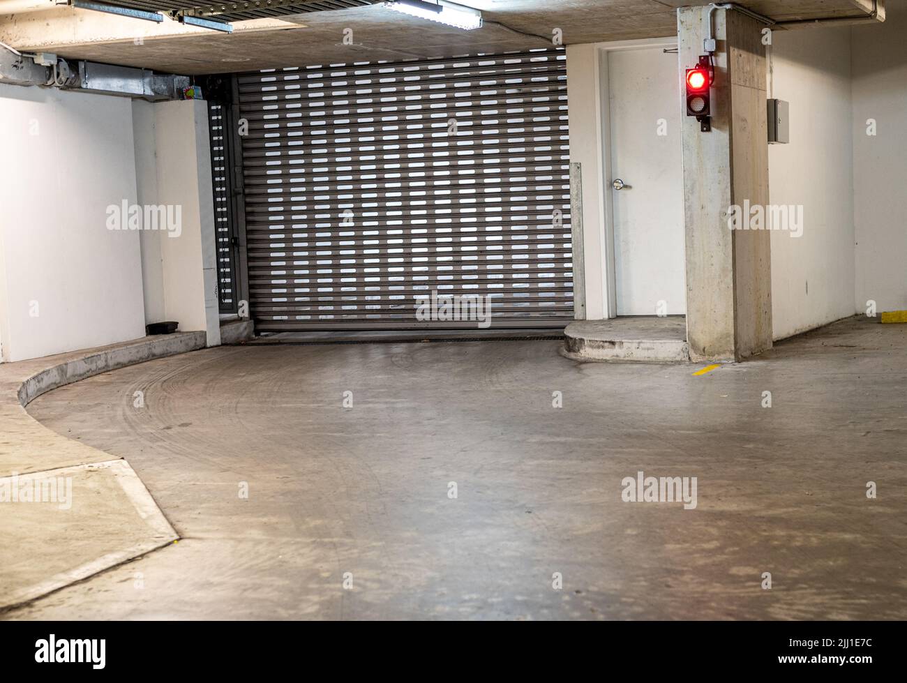apartment building sliding garage door with stop lights , one way Stock ...