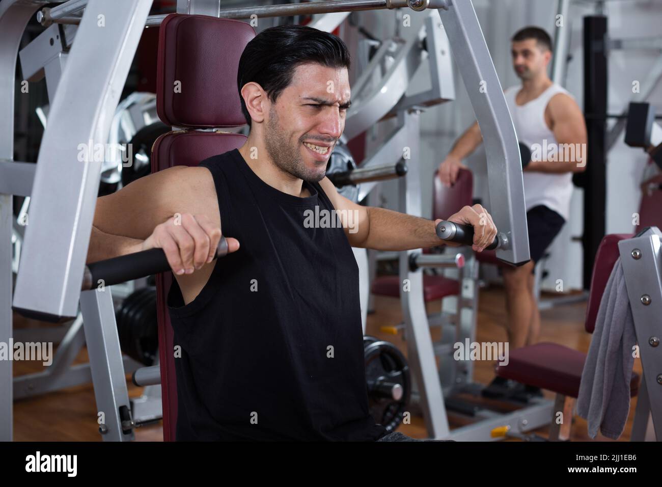 Biceps training machine hi-res stock photography and images - Alamy