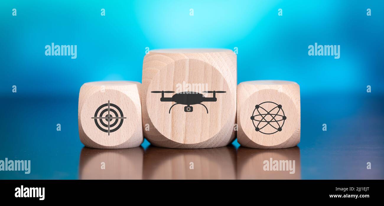 Wooden blocks with symbol of drone concept on blue background Stock ...