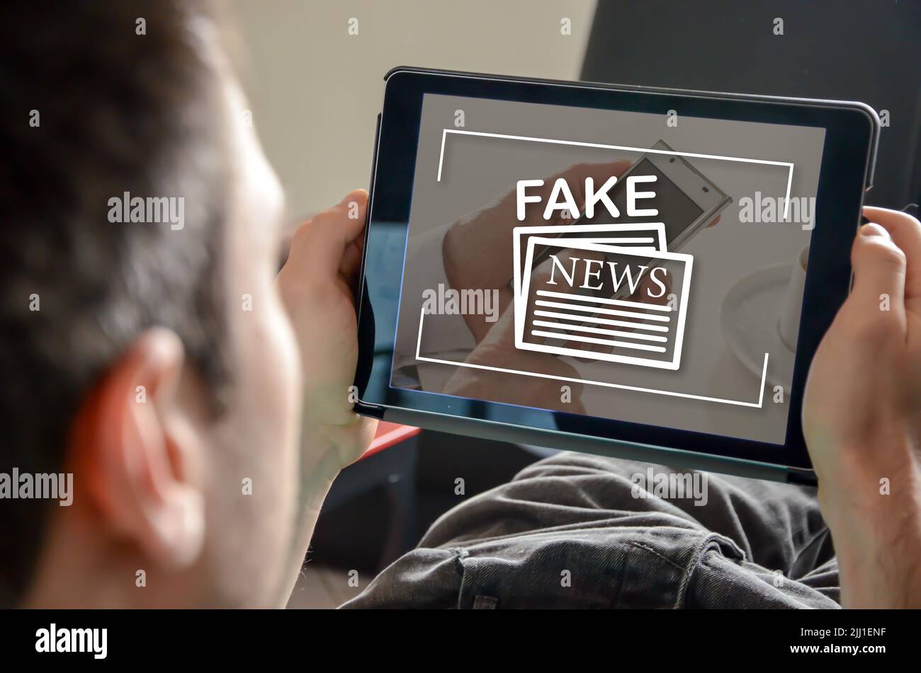 Fake news concept on a tablet Stock Photo - Alamy