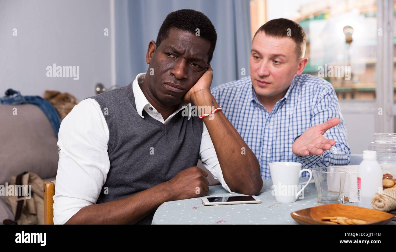 Man asking for forgiveness from offended African friend Stock Photo - Alamy Man asking for forgiveness from offended African friend Stock Photo - Alamy