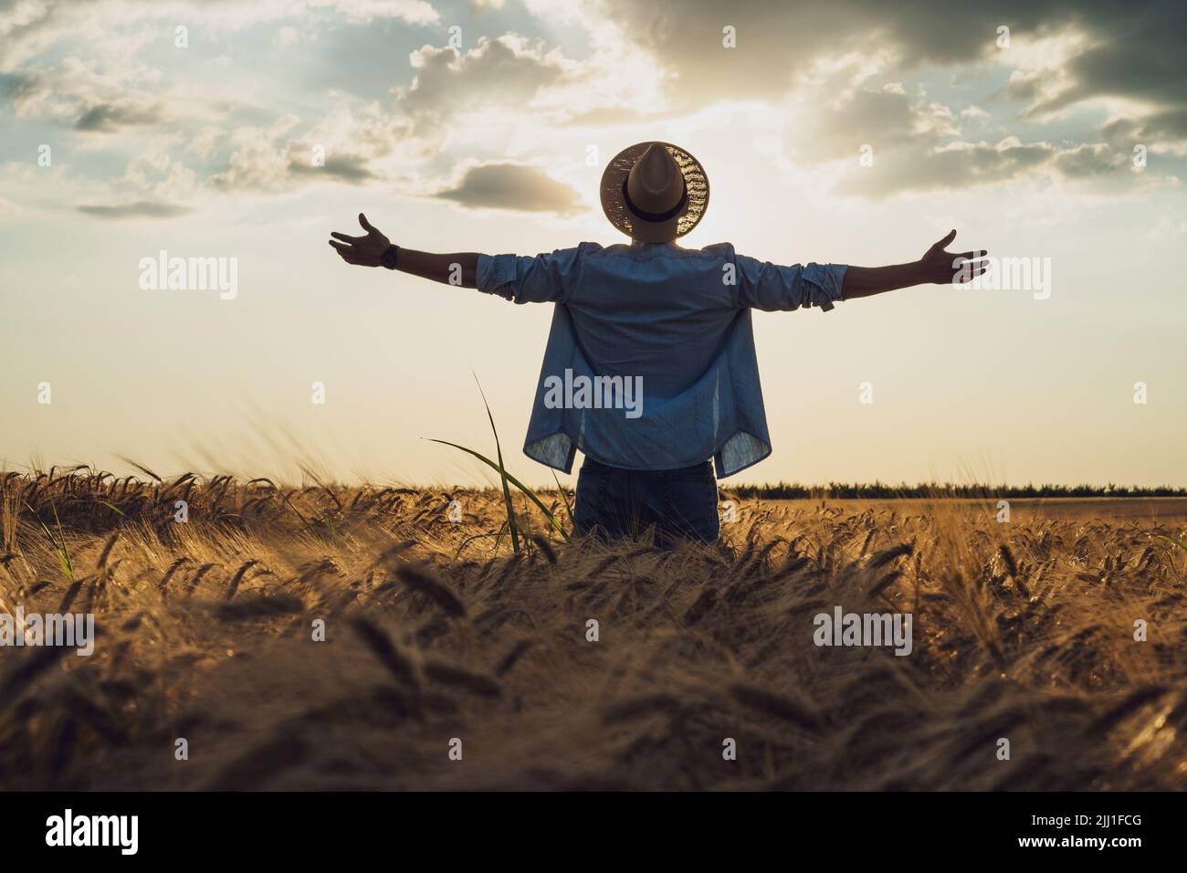 Silhouette man standing arms outstretched hi-res stock photography and ...