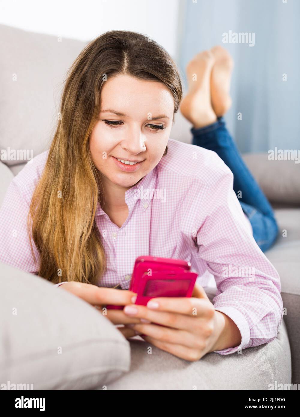 Woman using phone Stock Photo - Alamy