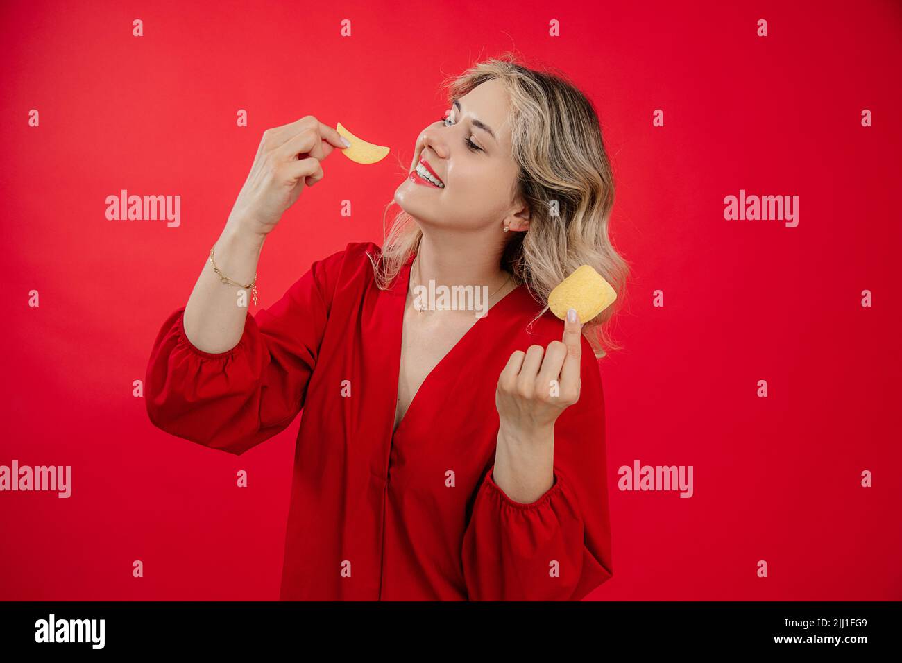 Fat woman eating chips hi-res stock photography and images - Alamy
