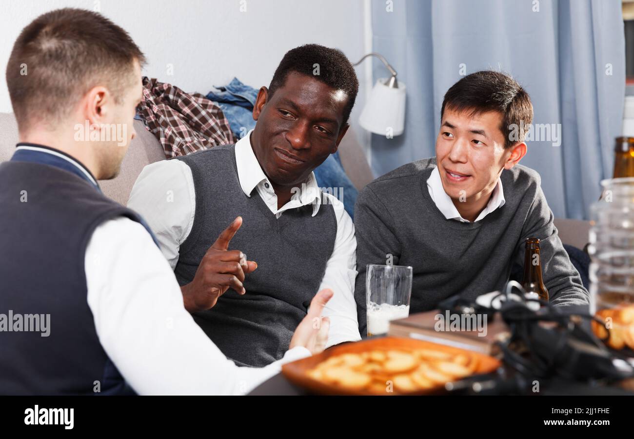 Males friendly meeting over beer Stock Photo - Alamy
