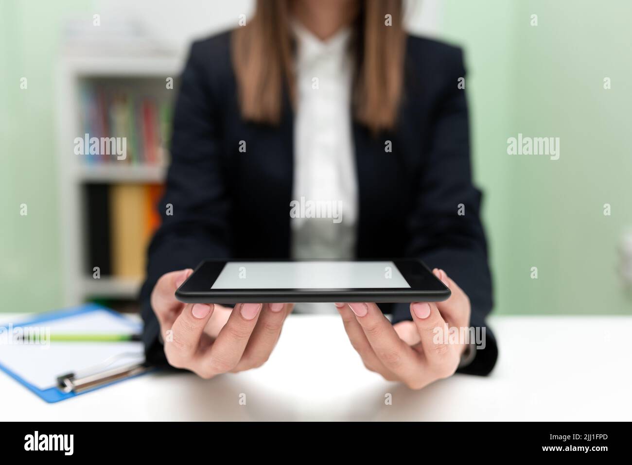 Businesswoman Holding Cellphone With Both Hands With Important Messages ...