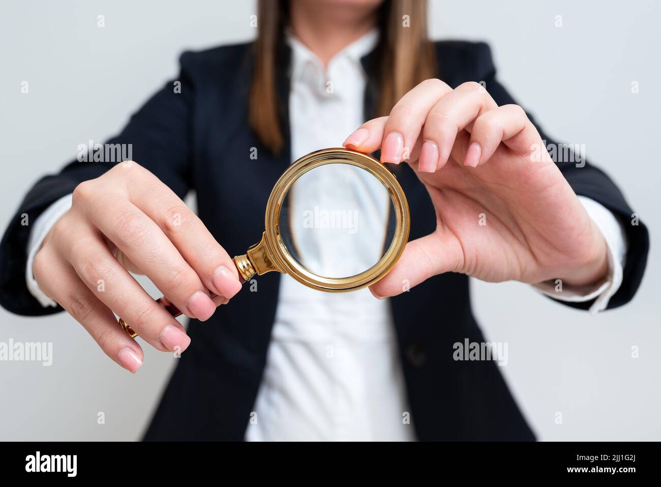 Businesswoman Holding Magnifier With Both Hands. Woman Having ...