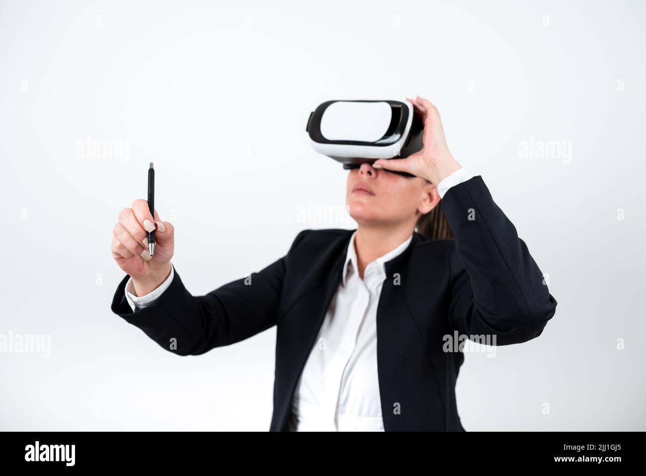 Woman Wearing Vr Glasses And Pointing On Recent Updates With Pen ...
